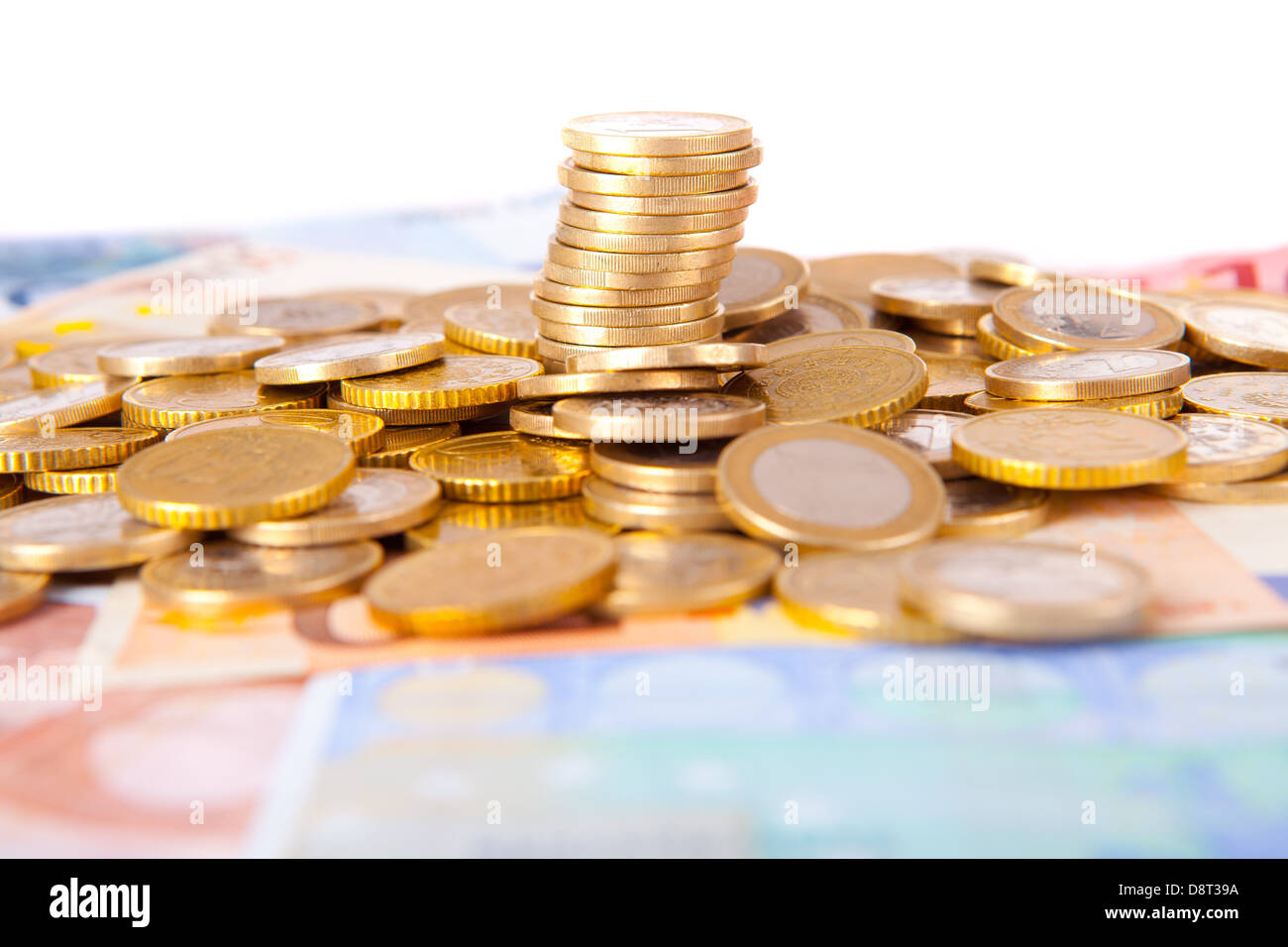 Pile of notes and coins Stock Photo - Alamy