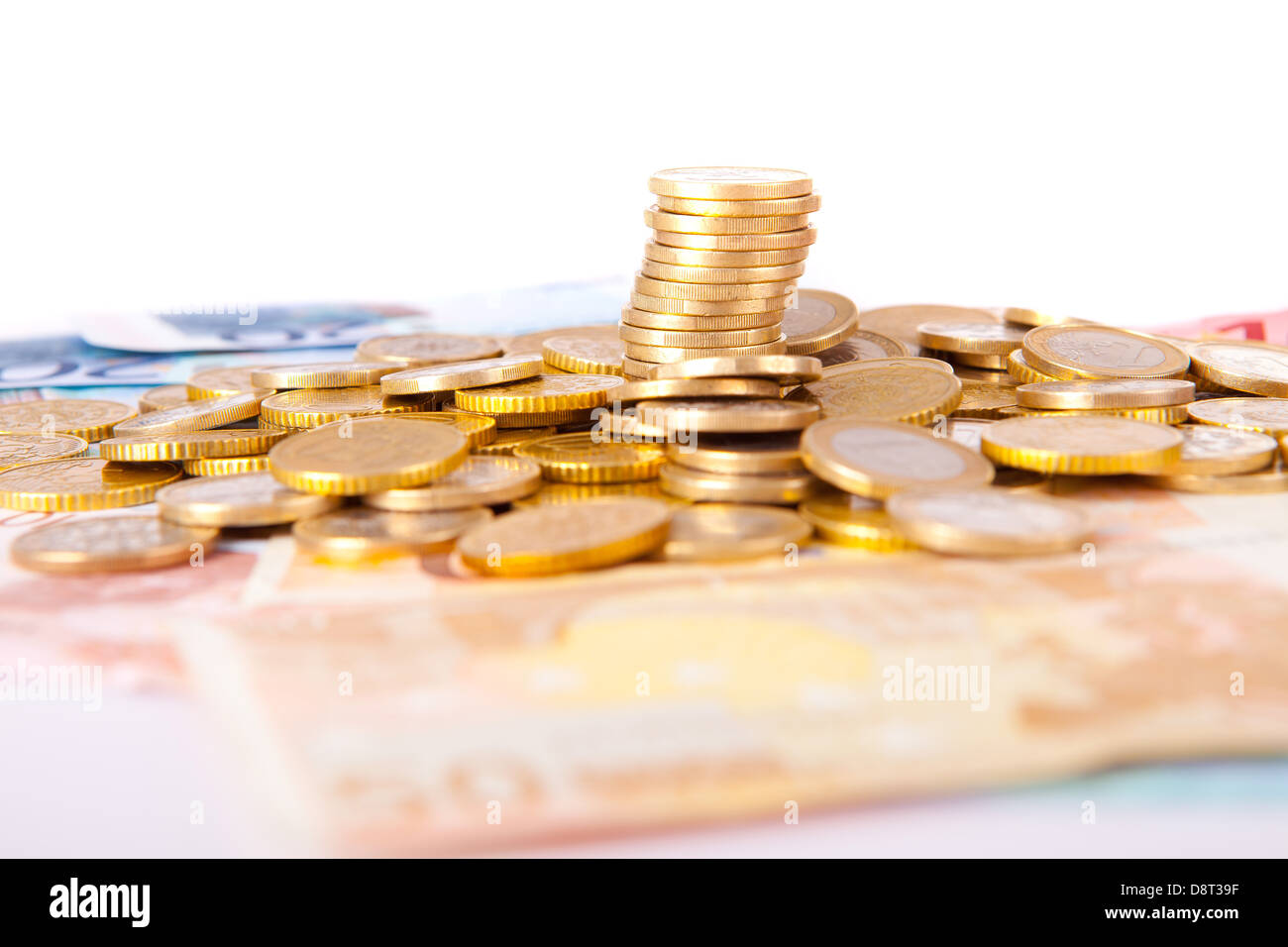 Pile of notes and coins Stock Photo - Alamy