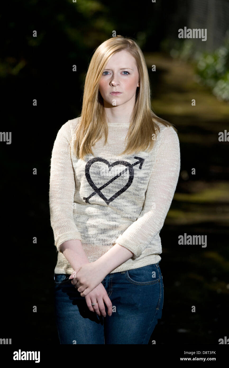 A Young woman standing outside by herself Stock Photo - Alamy