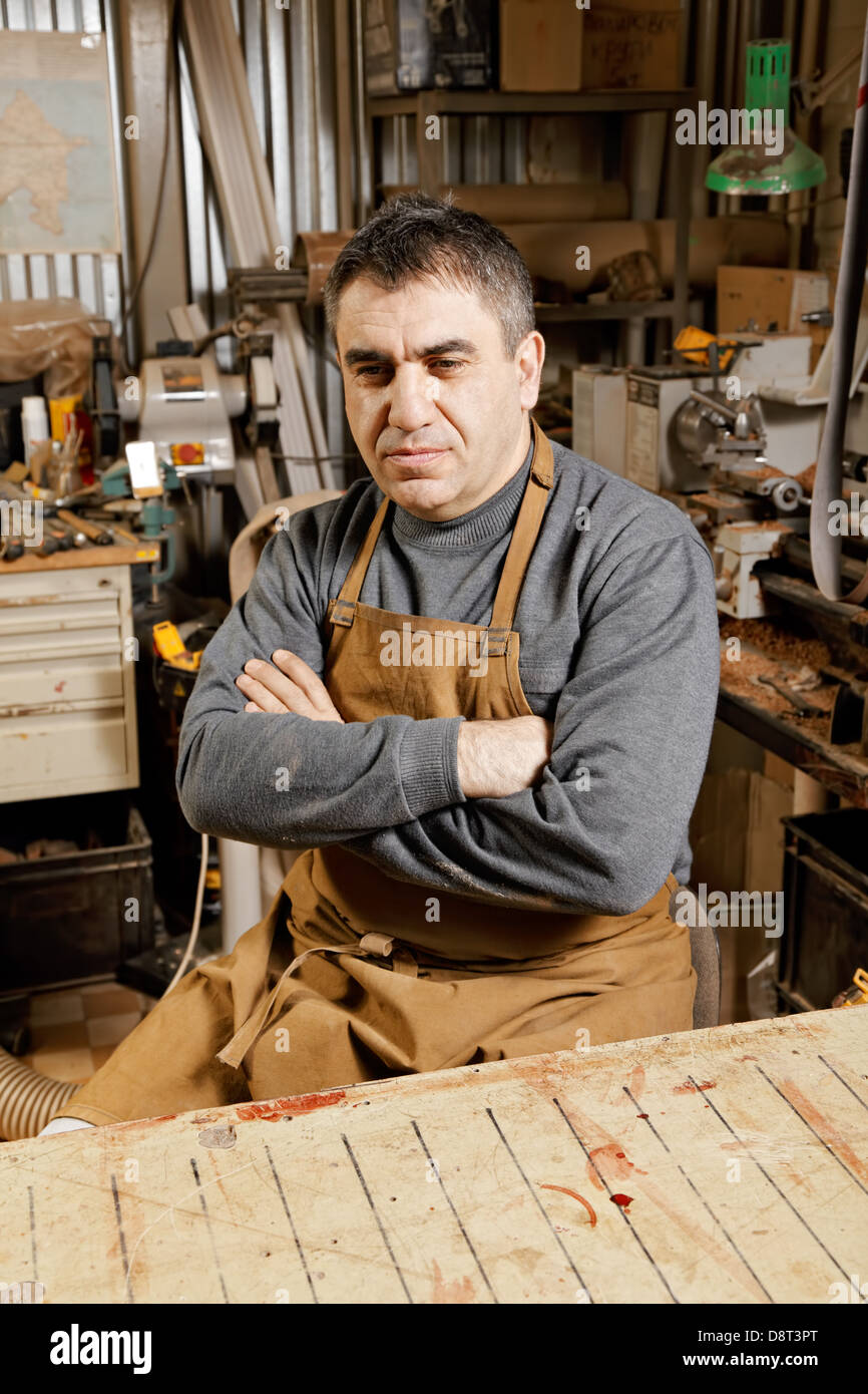Artisan at workbench Stock Photo - Alamy