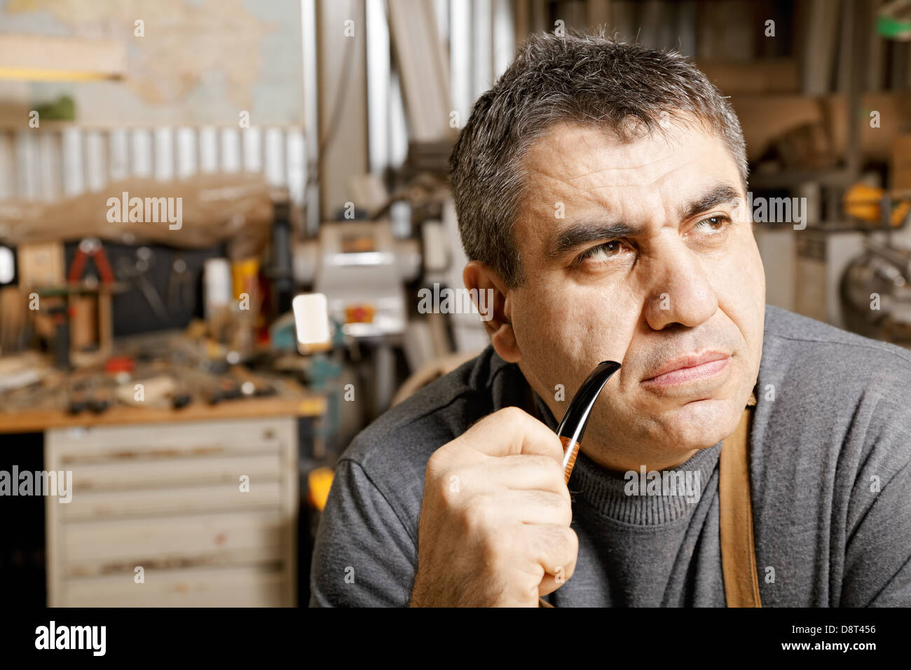 Middle-aged man with smoking pipe Stock Photo - Alamy