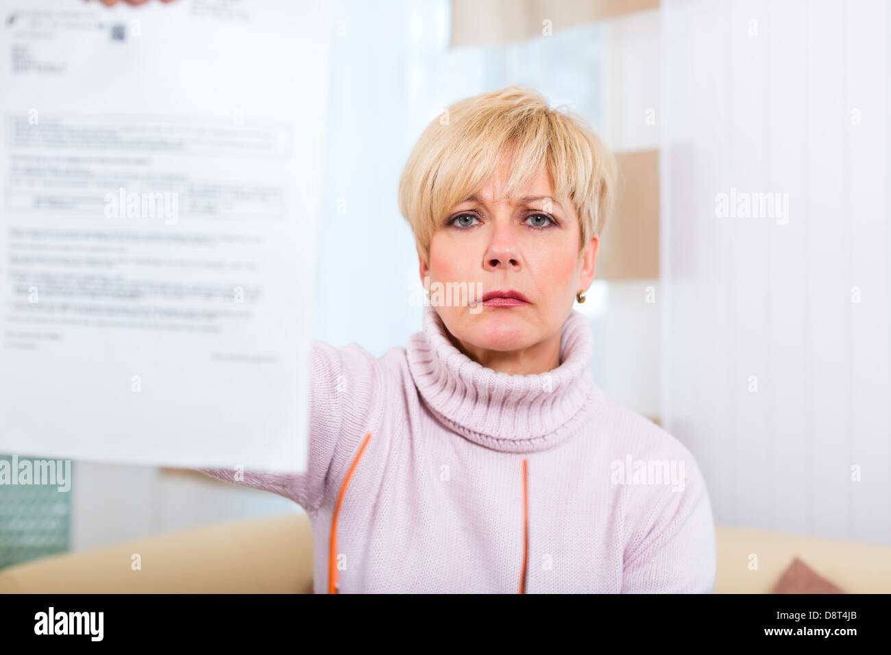 Older Woman or Senior have received a letter, maybe it's a reminder or ...