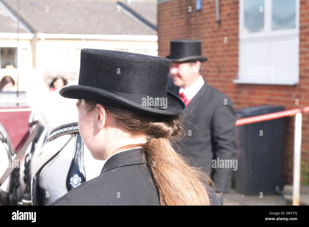 rear of horseman on carriage in black showing close up of hat Stock ...
