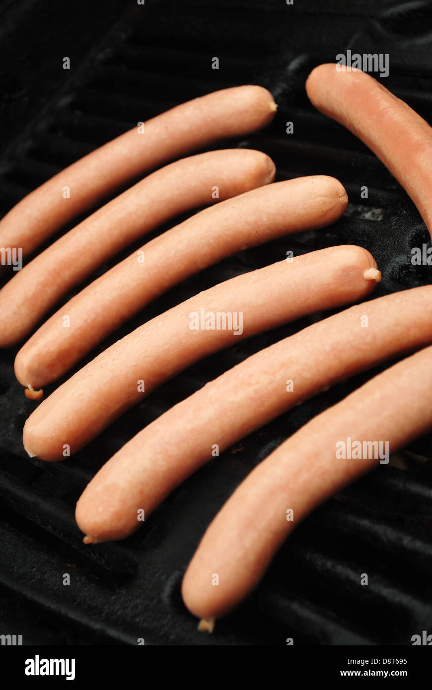 Raw Hot Dogs on a Summer Grill Stock Photo - Alamy