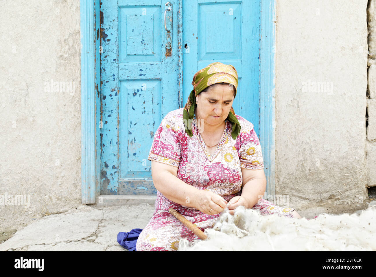 Woman loosening wool Stock Photo - Alamy