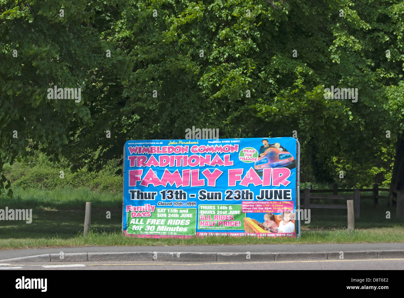 billboard advertising a funfair on wimbledon common, southwest london ...