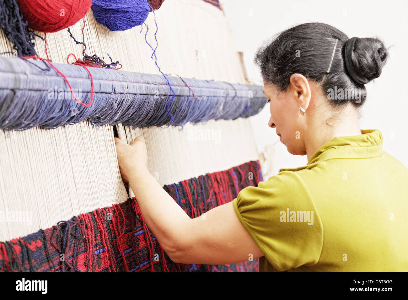 Woman working on loom hi-res stock photography and images - Alamy