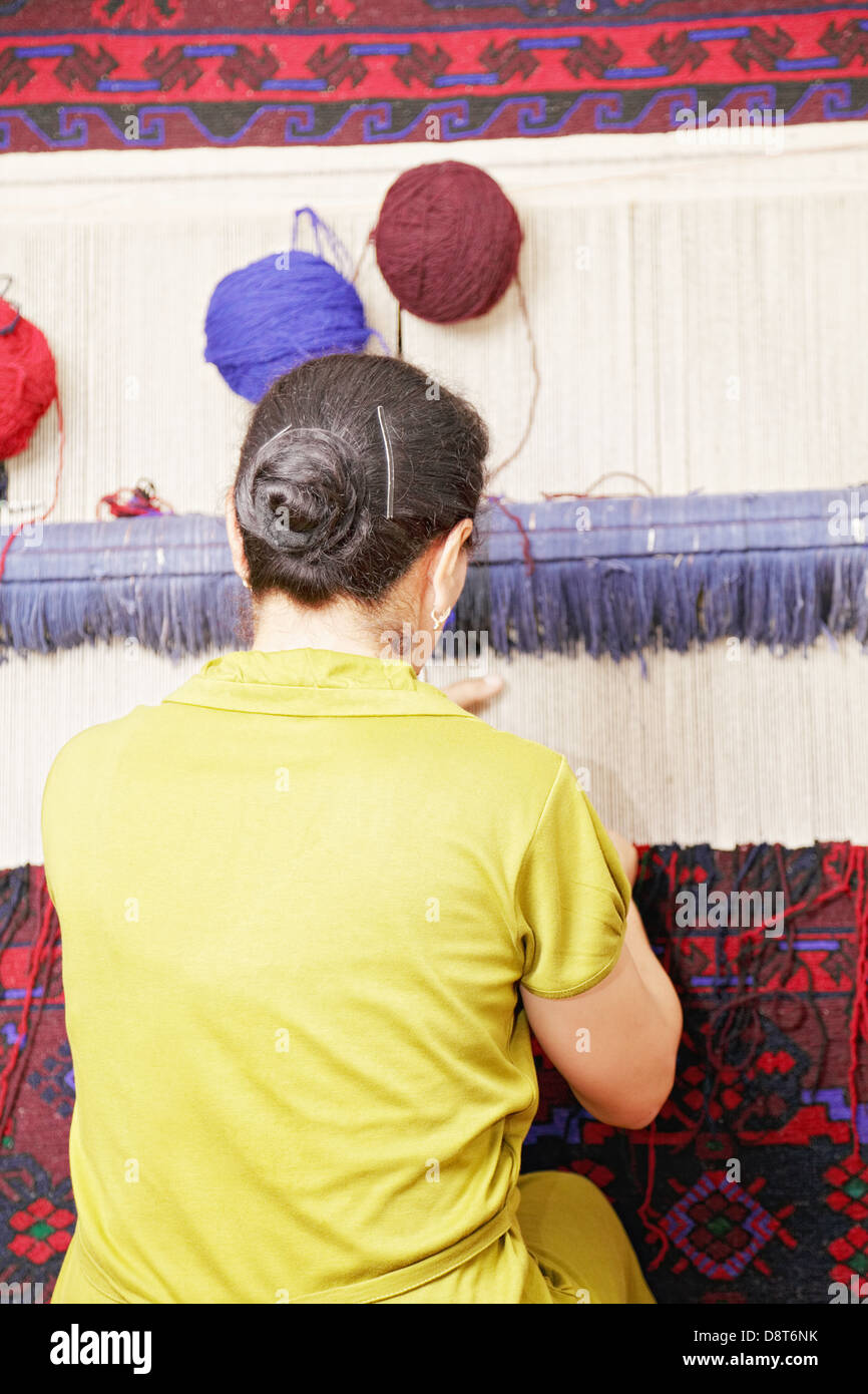 Middle-aged carpet weaver Stock Photo - Alamy