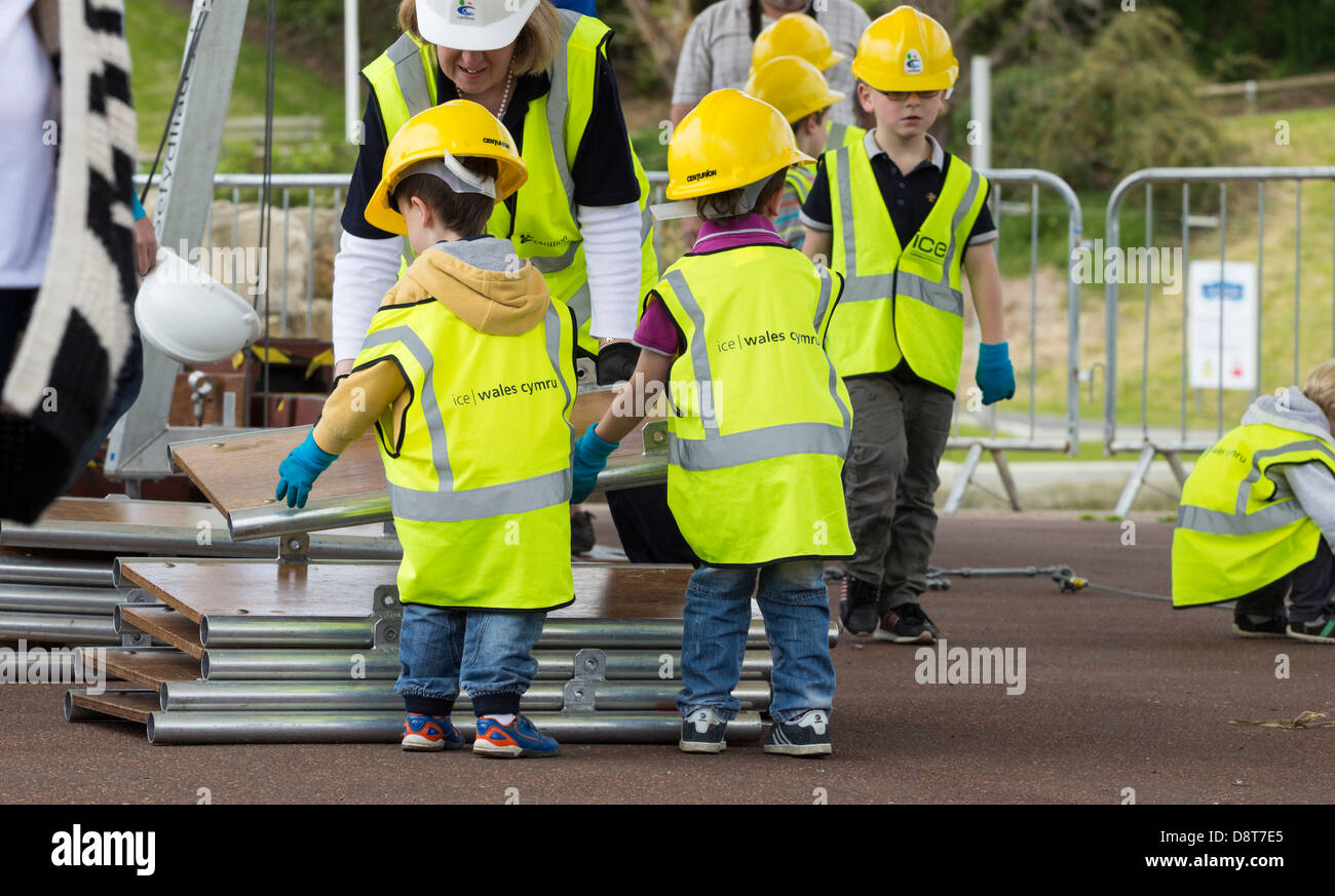 Children helping to build bridge at Institute of Civil Engineers stand ...