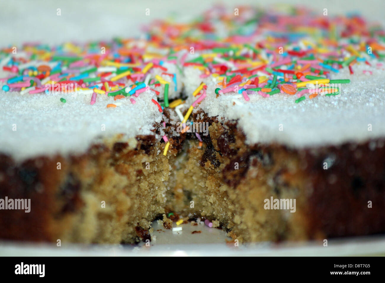 Cake with cut-out piece Stock Photo - Alamy