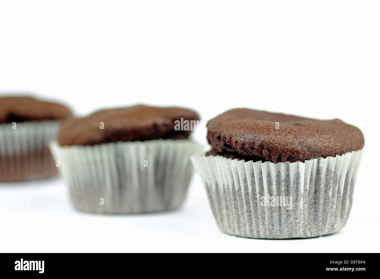 Muffins on the white background Stock Photo - Alamy