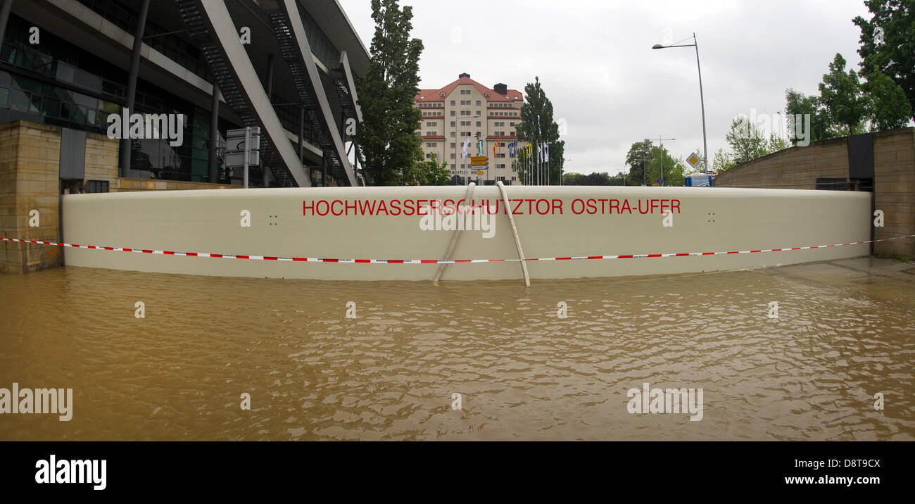 Water from the river Elbe stands in front of flooding protection gate ...