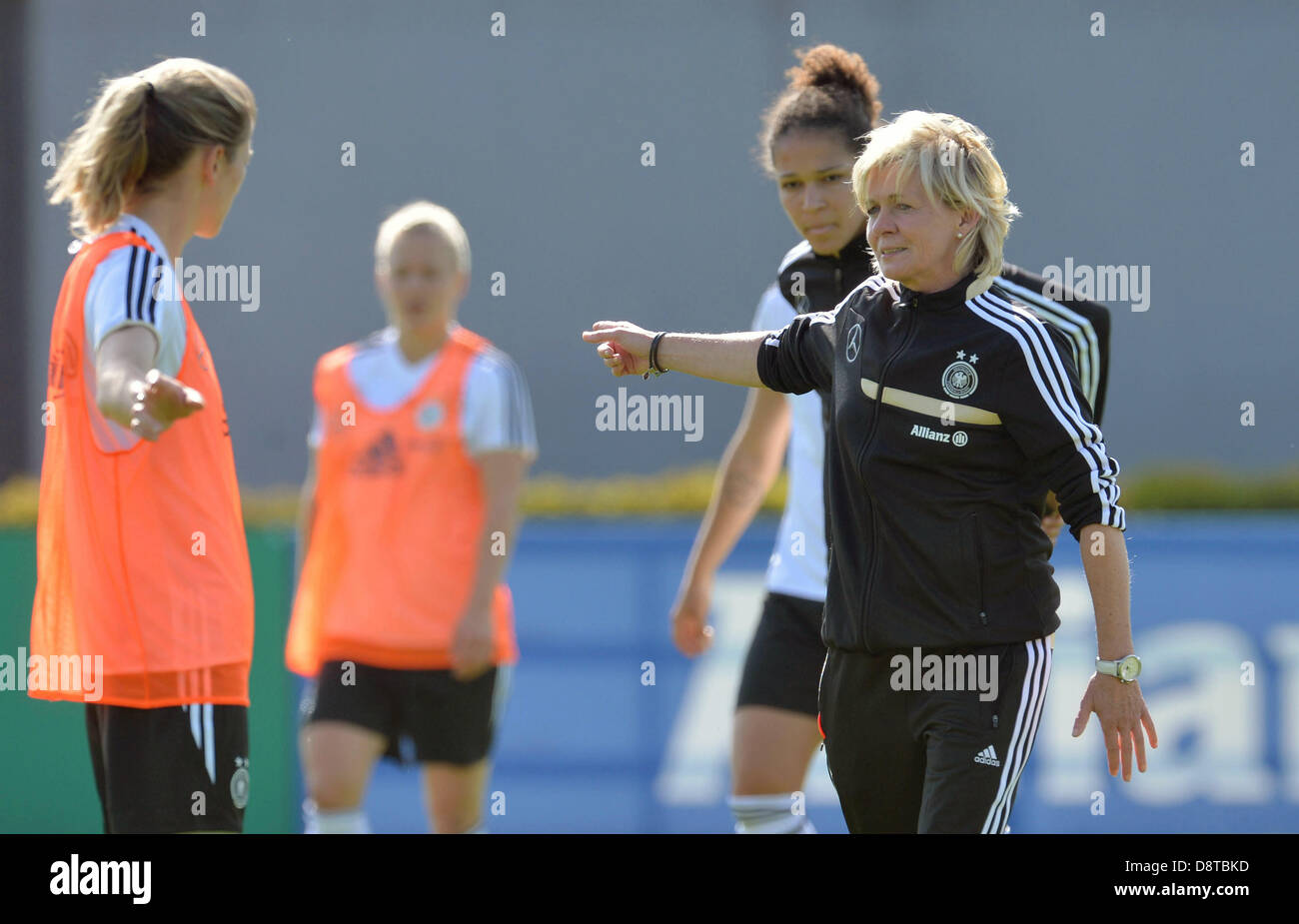 German national coach Silvia Neid talks with player Bianca Schmidt (L ...
