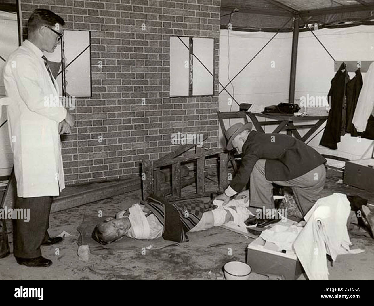 This historical black-and-white image captures a first aid competition ...