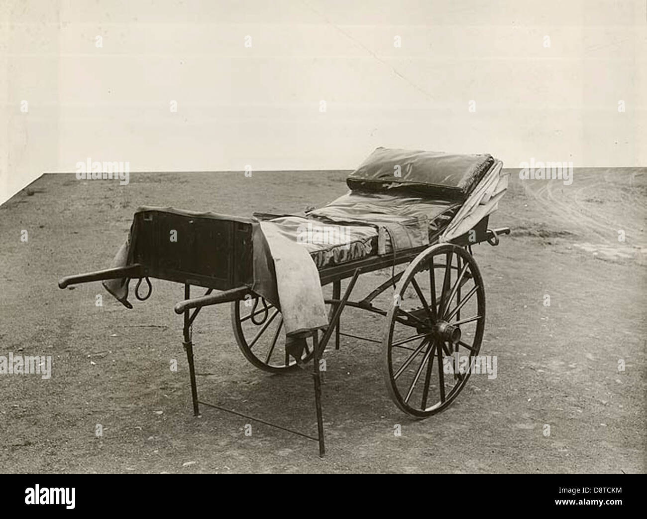 This image depicts an old-fashioned stretcher, once used for emergency ...