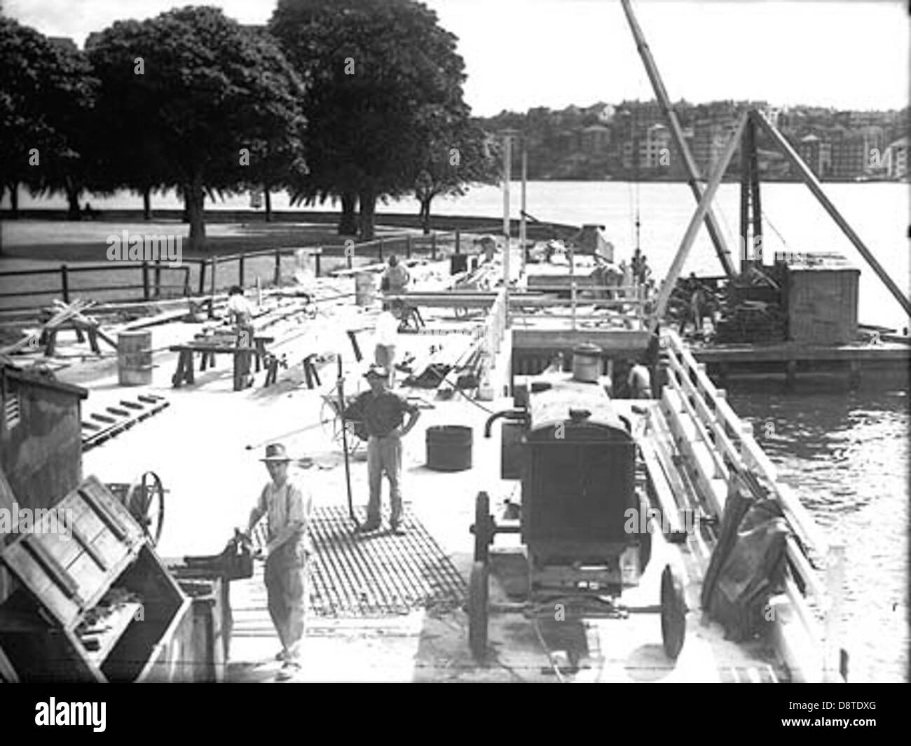 This historical photograph captures the construction of the wharf at ...