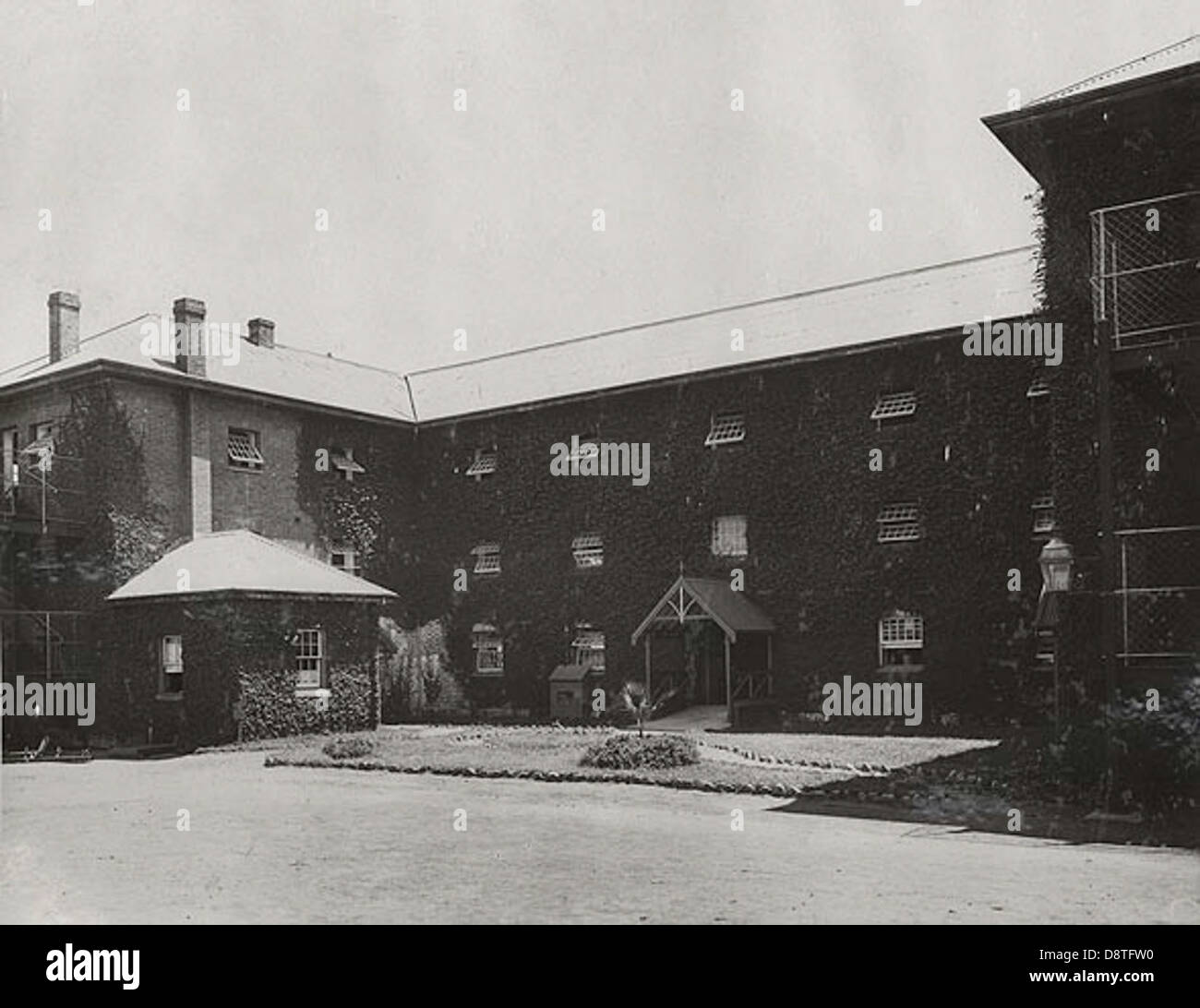 This black-and-white photograph depicts the George St Asylum, also ...