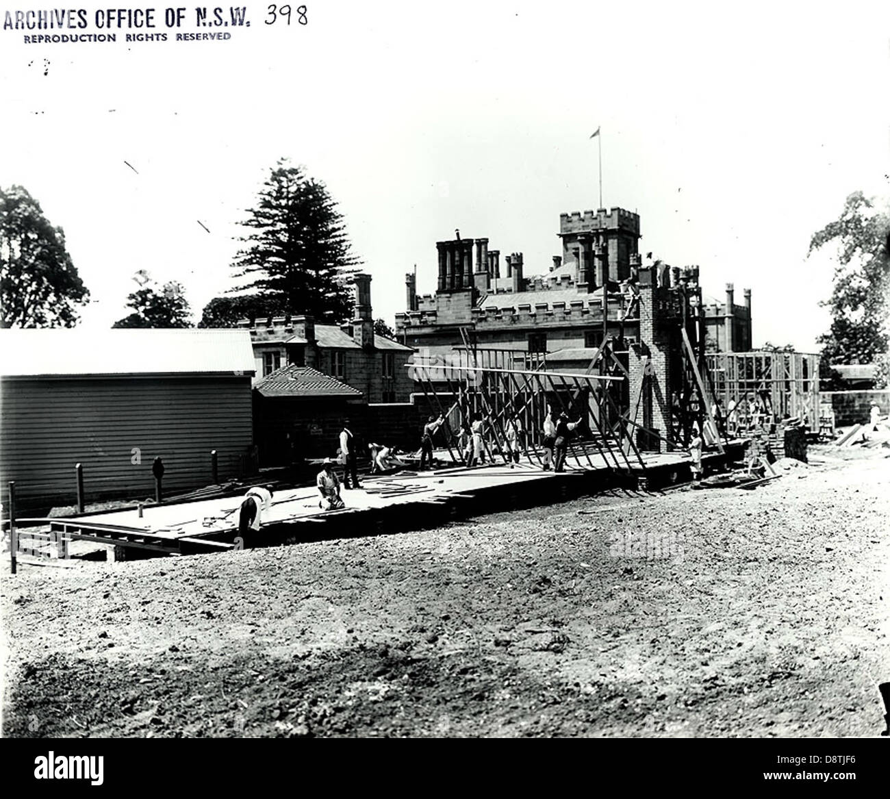 A black-and-white photograph showing the NSW Government House in Sydney ...