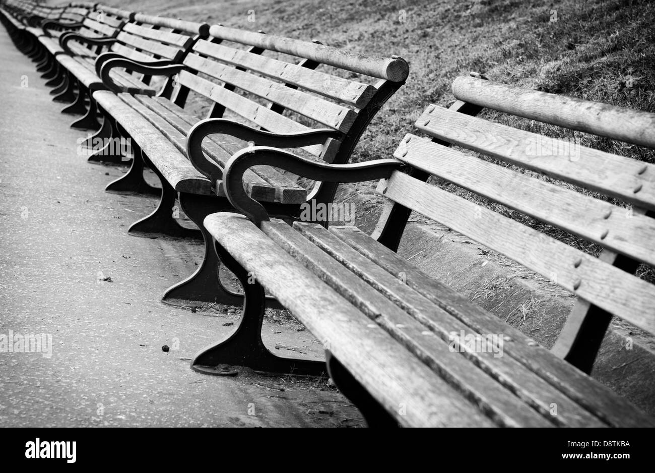 long row of park benches Stock Photo - Alamy