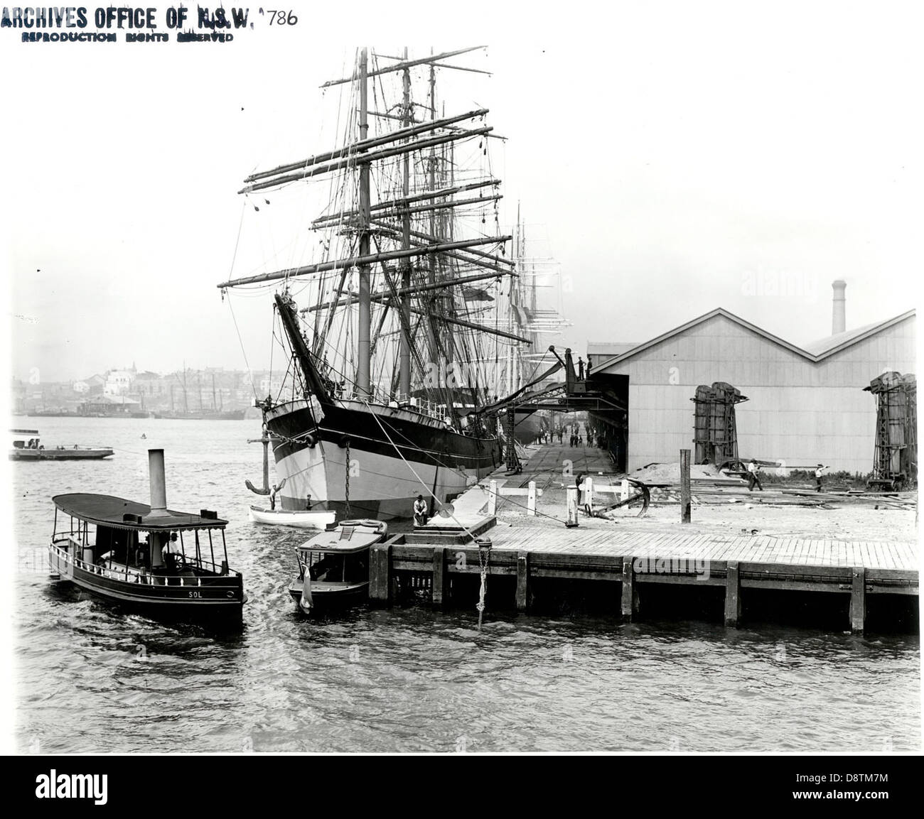 This historic photograph from 1904 captures a view across Pyrmont Bay ...