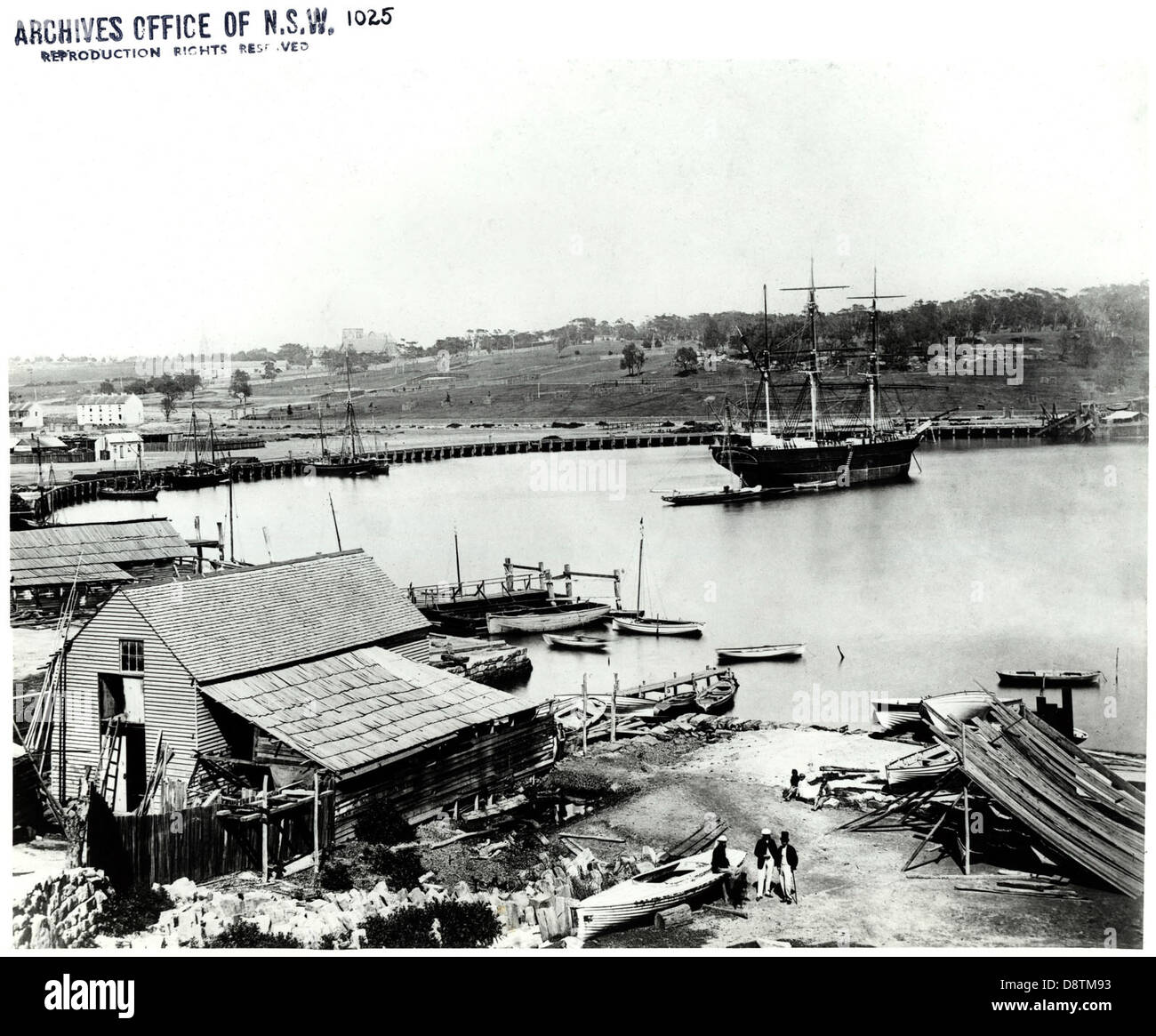 This historical black and white photograph captures Woolloomooloo Bay ...