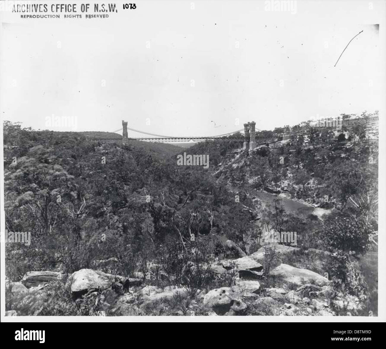The black-and-white photograph captures the iconic suspension bridge in ...