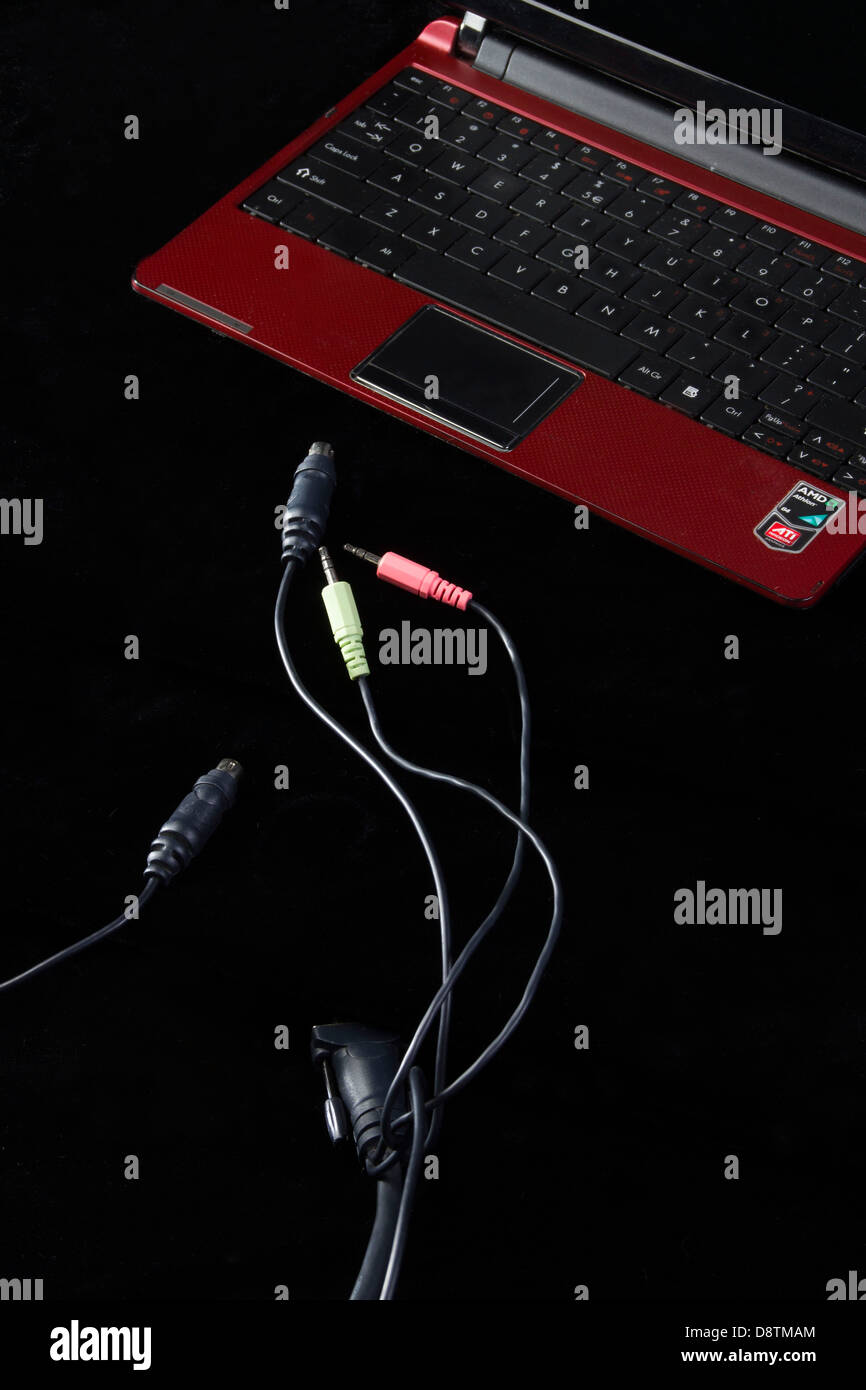 red computer with unplugged wires Stock Photo - Alamy