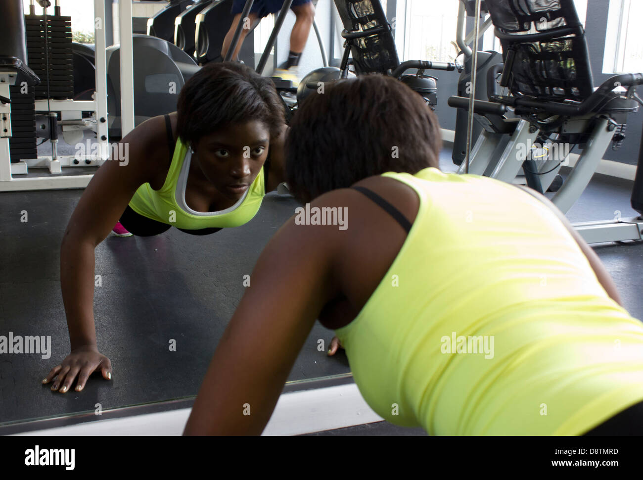 Woman exercising in a gym Stock Photo - Alamy