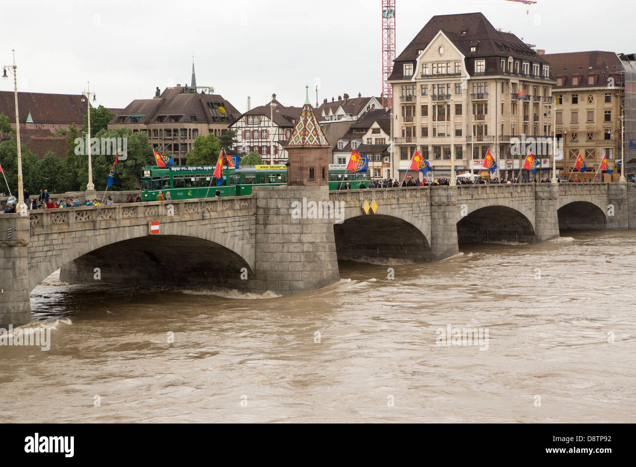 High flood waters on the Rhine river in Basel, Switzerland. The bridge ...