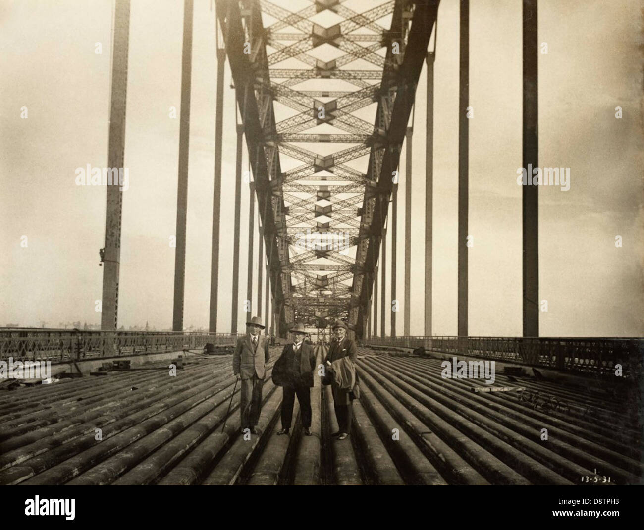 This historical black-and-white image shows the construction of the ...