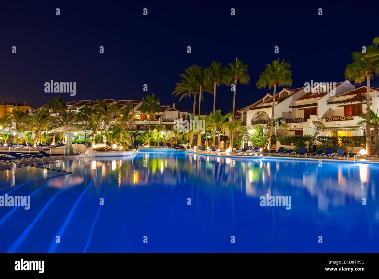 Swimming pool at night Stock Photo - Alamy