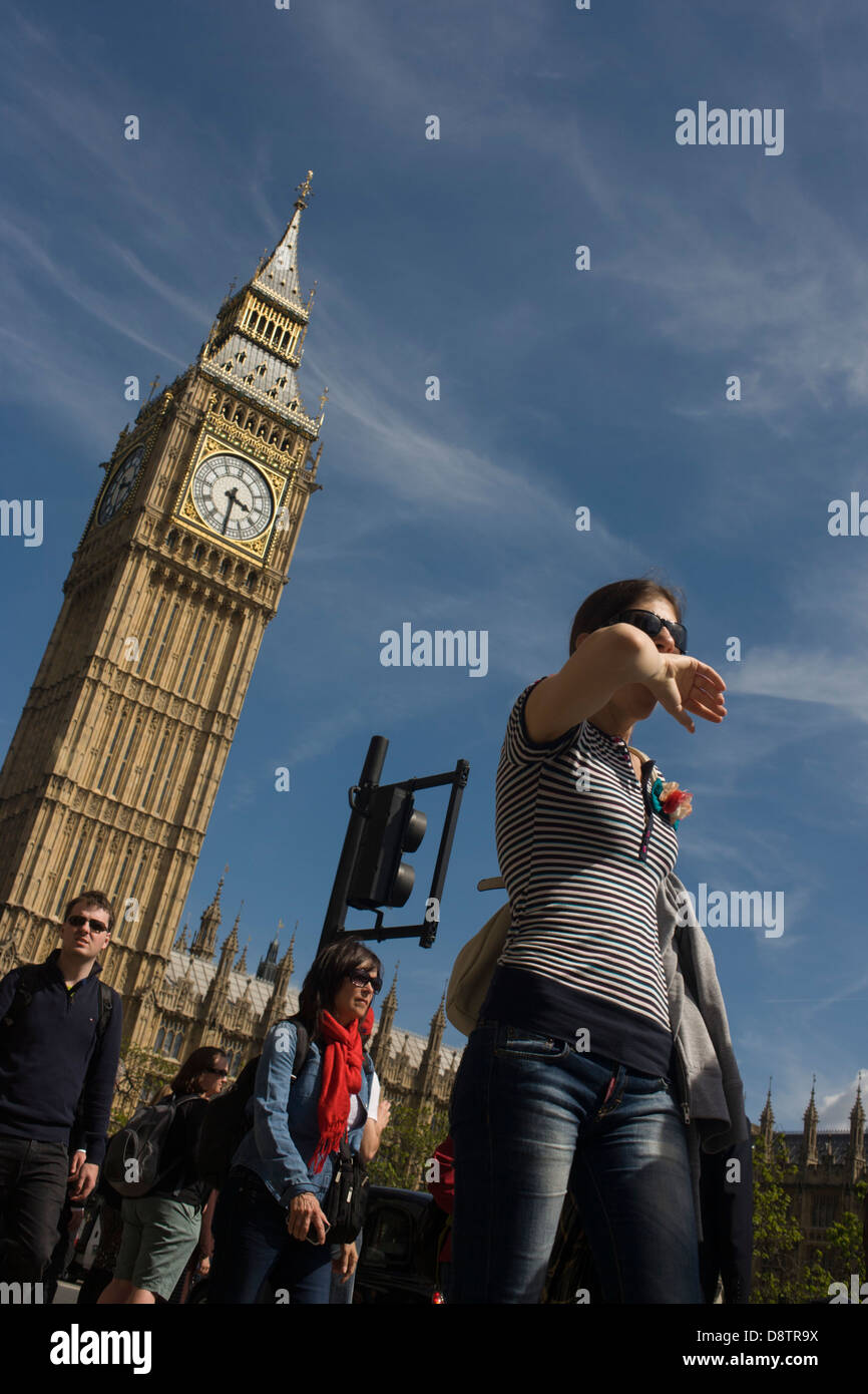 Londoners and visitors pass beneath Big Ben (now called Elizabeth Tower ...