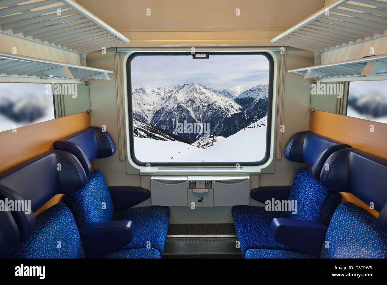 Interior of train and mountains in window Stock Photo - Alamy