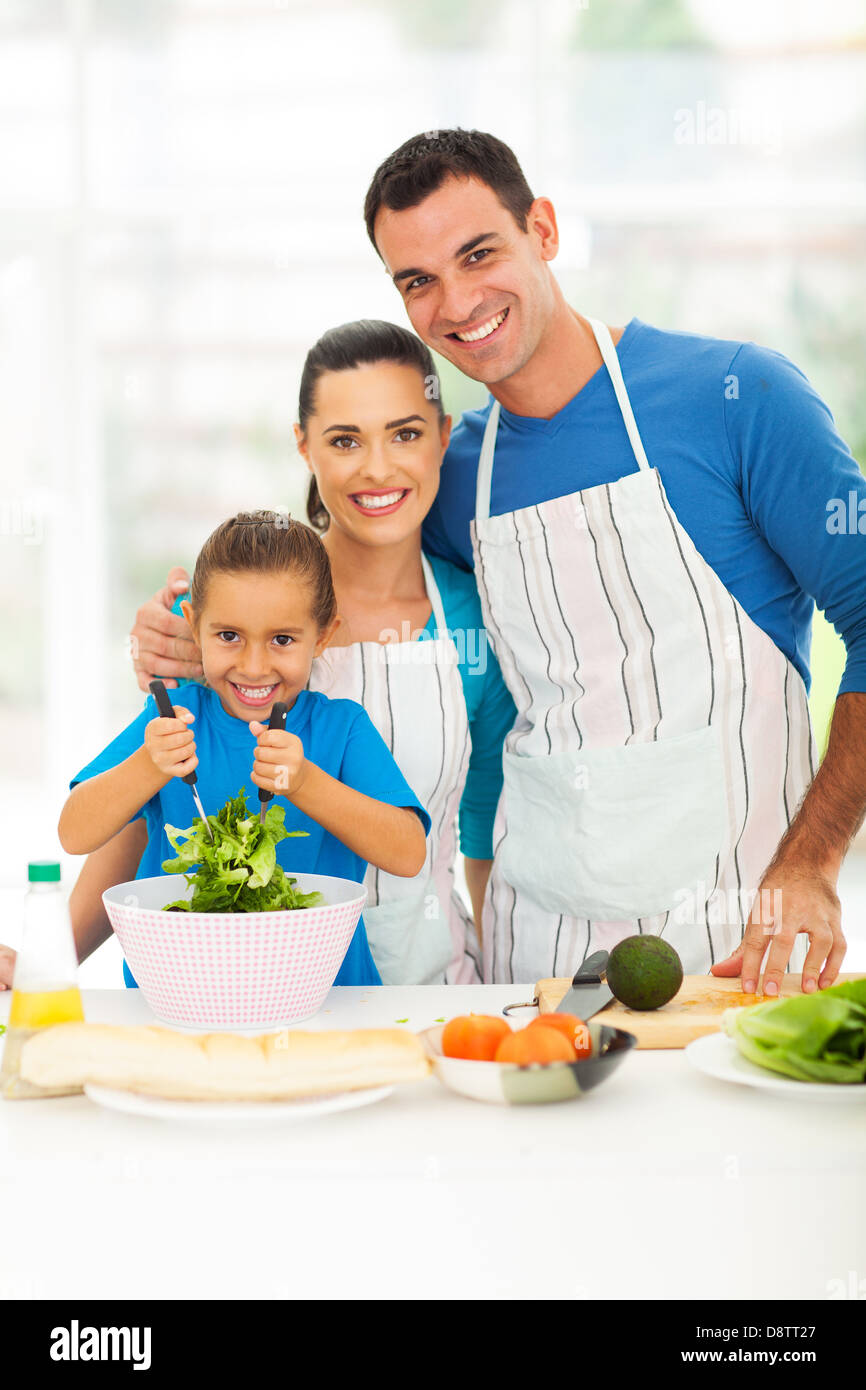 beautiful young family cooking in kitchen at home Stock Photo - Alamy