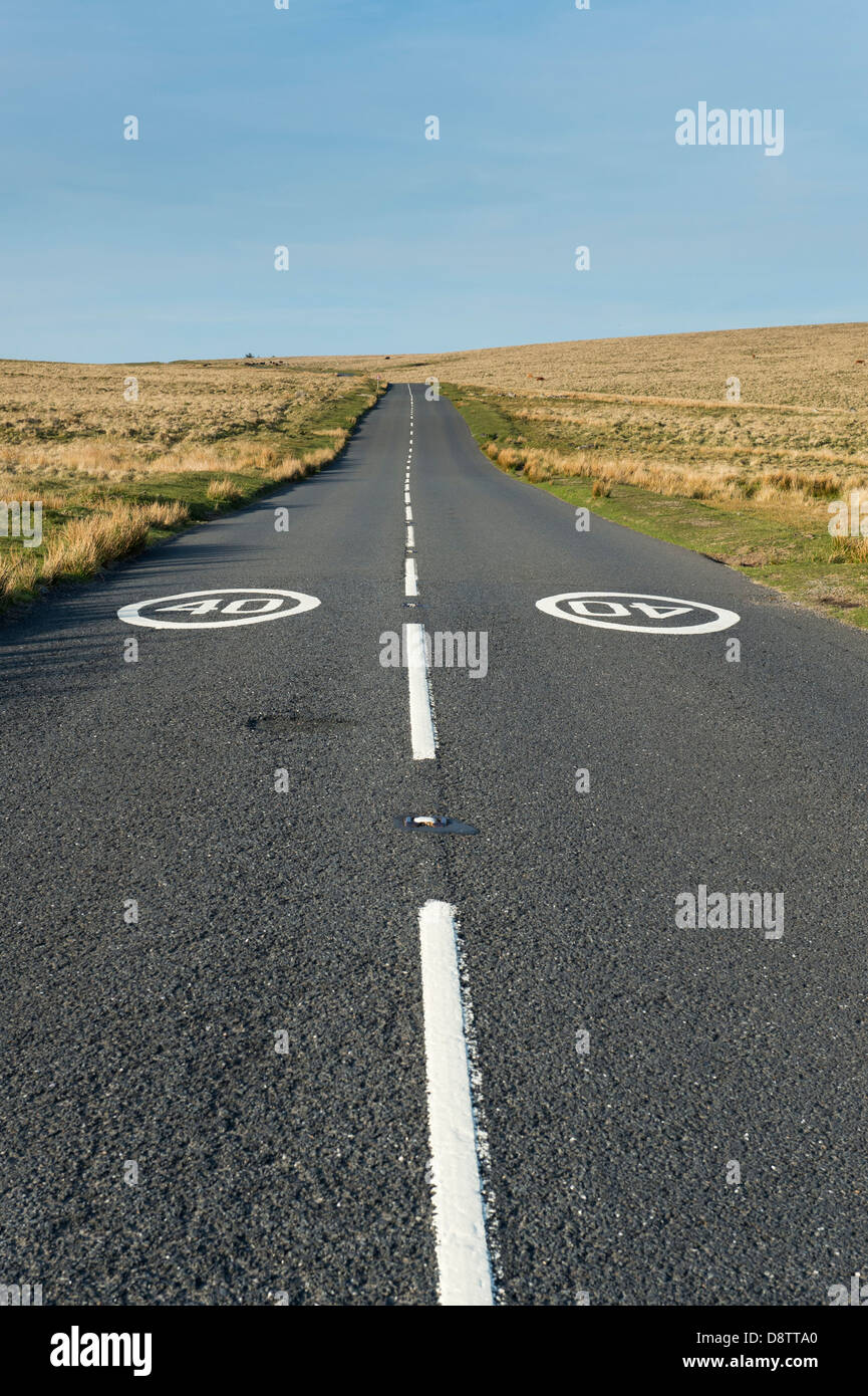Straight road with 40mph road signs on Dartmoor national park, Devon ...