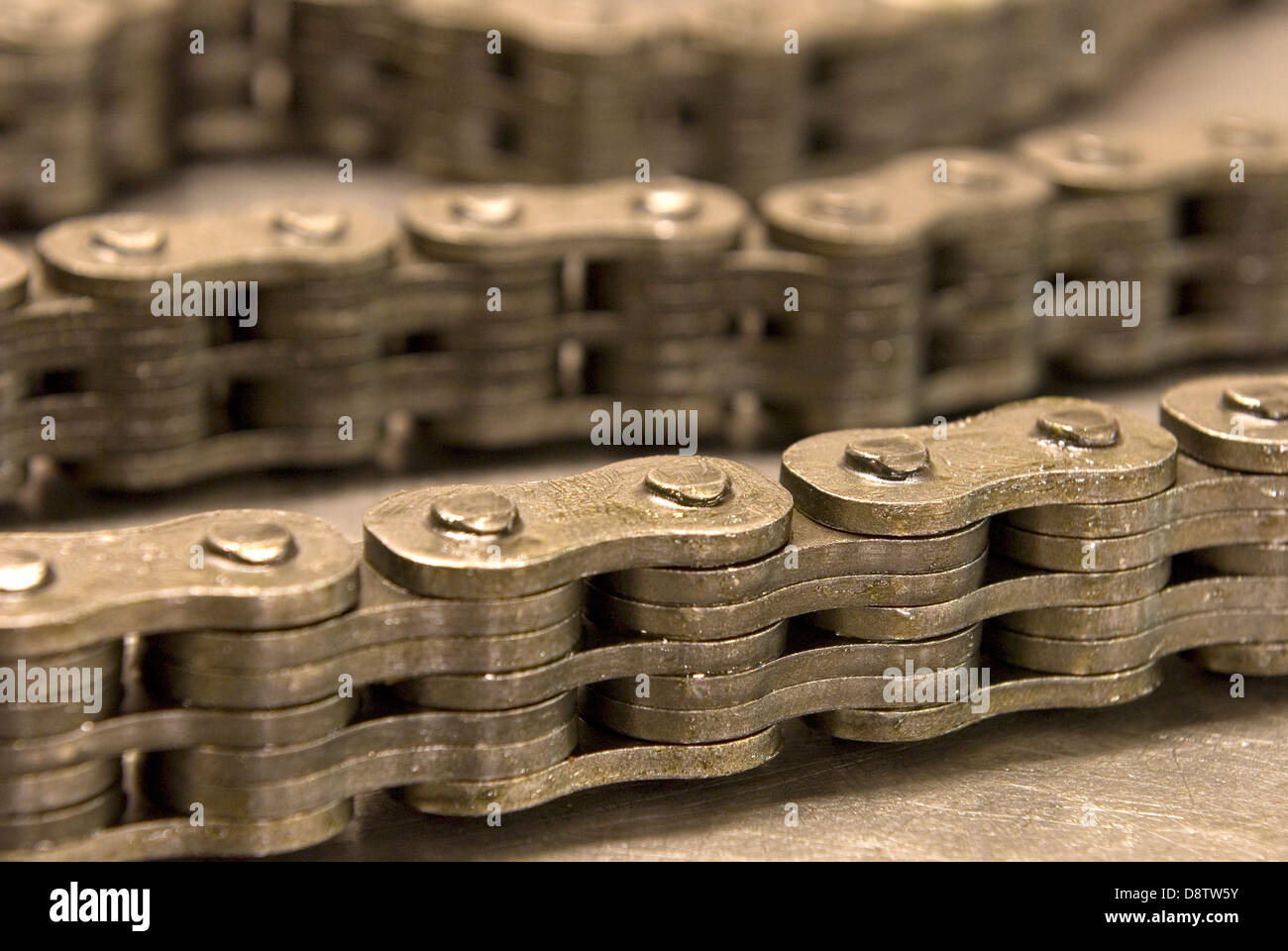 chain for forklift coiled on work bench showing close up for links ...