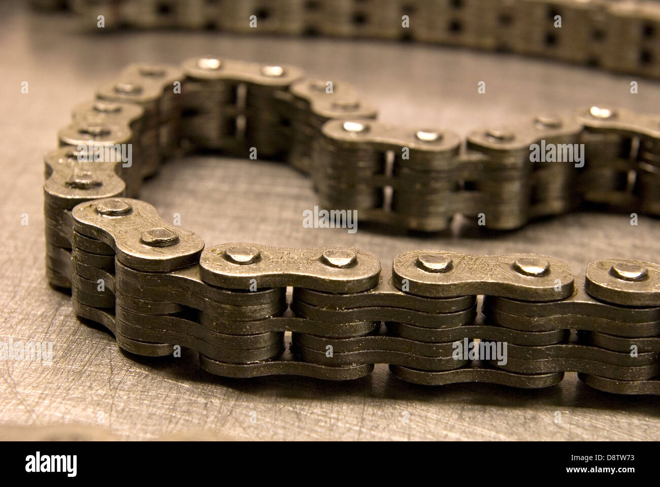 chain for forklift coiled on work bench showing close up for links ...