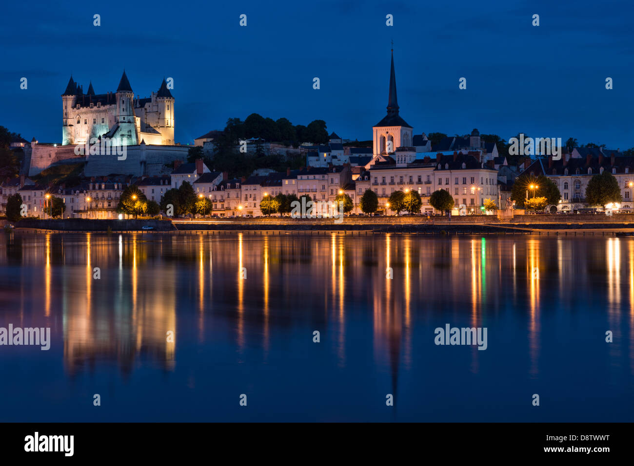 The Château and town of Saumur, in the Loire Vally, France. Illuminated ...