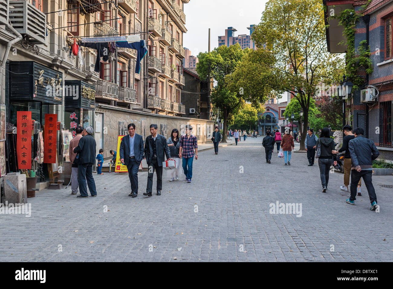 Shanghai, China - April 7, 2013: people walking in the pedestrian way ...