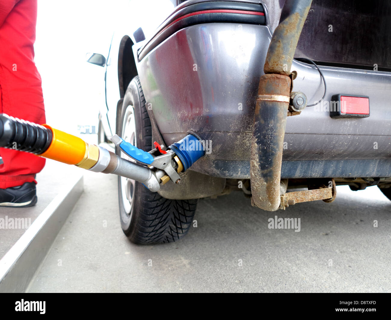 car at gas station being filled with fuel Stock Photo - Alamy