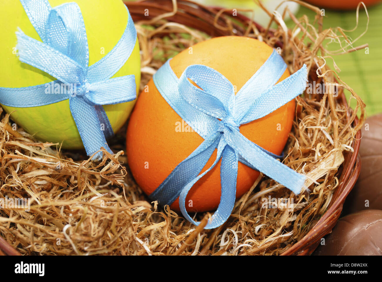 Colorful easter eggs in the basket Stock Photo - Alamy
