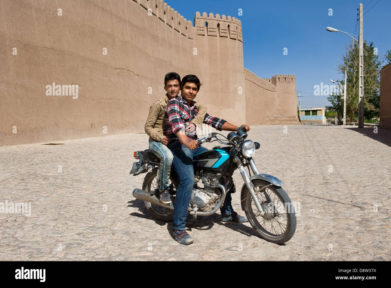 Iran, Rayen, Arg E Rayen citadel, boys Stock Photo - Alamy