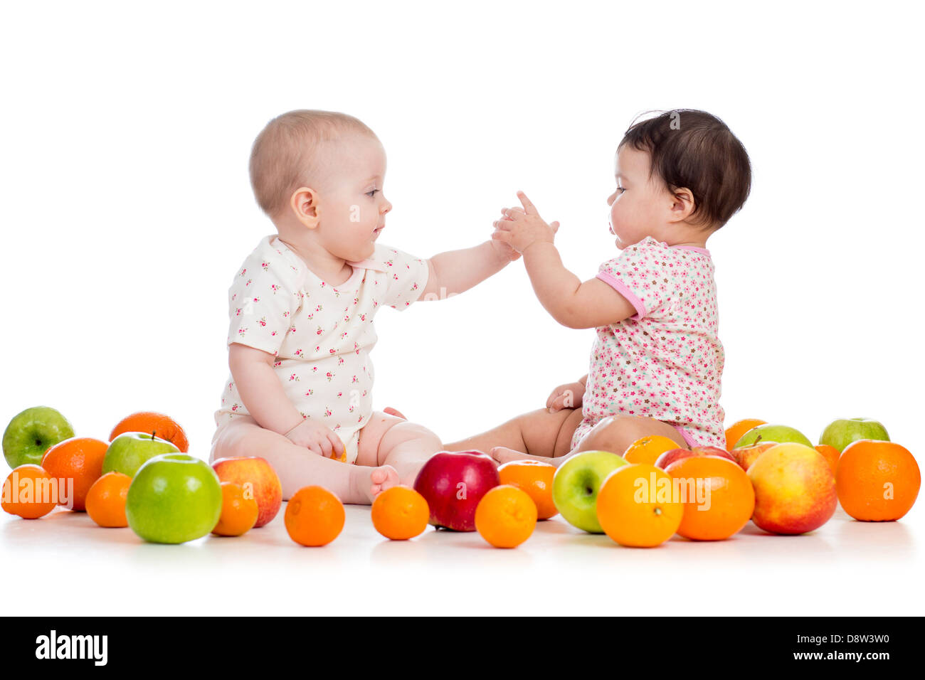 babies eating fruits Stock Photo - Alamy