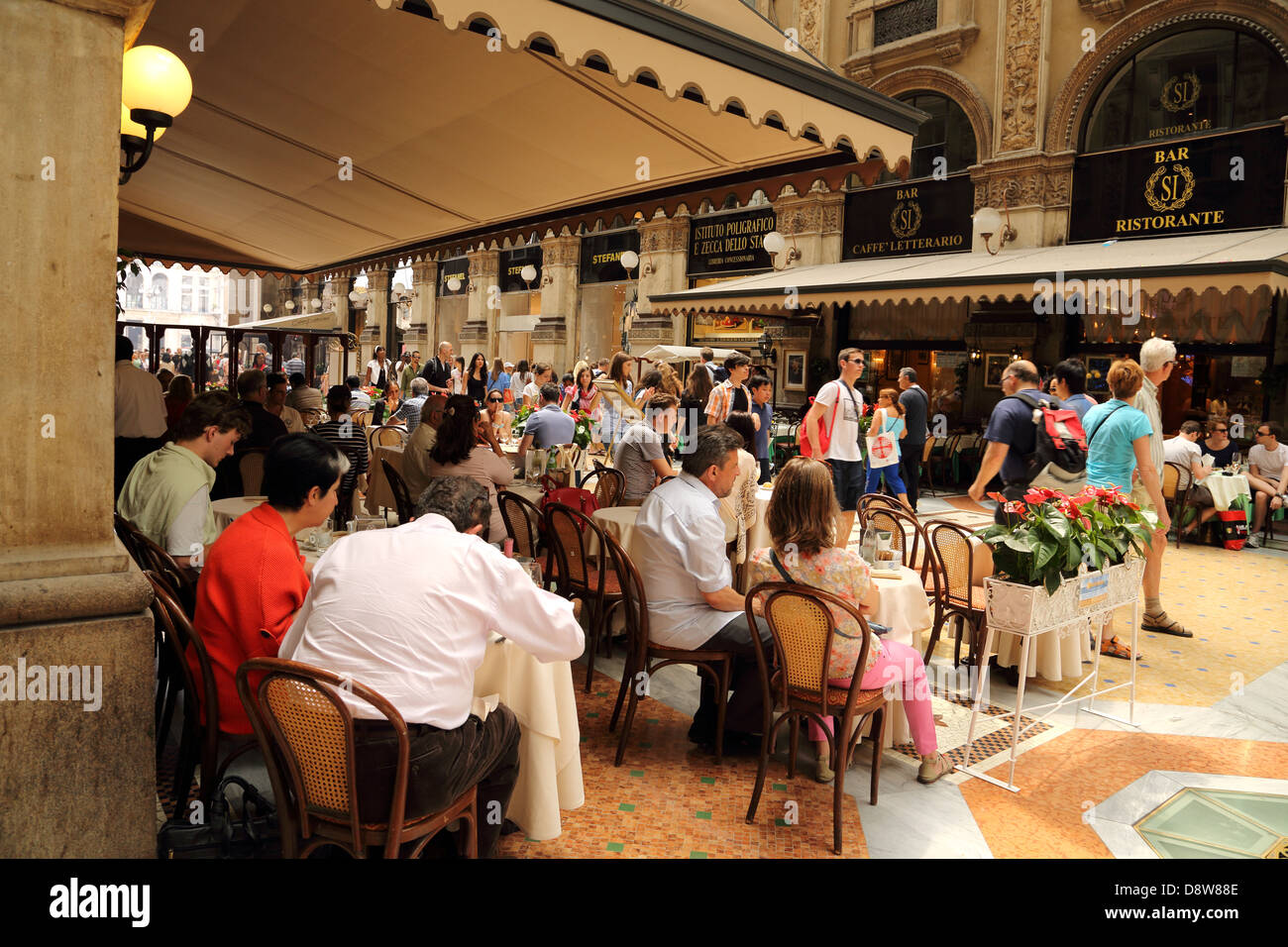 People sitting in a cafe in historic Galleria Vittorio Emanuele in ...