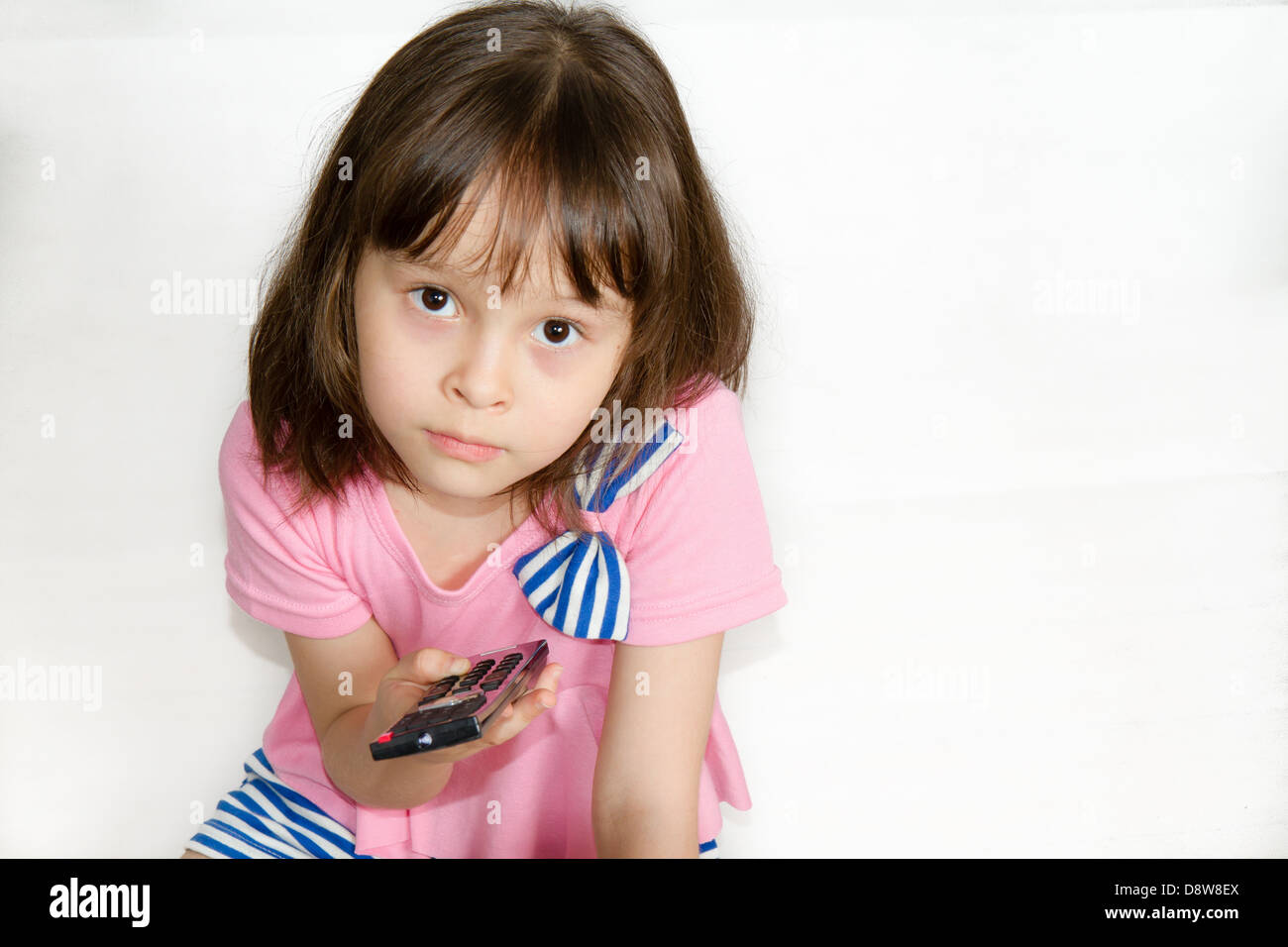 Asian child with remote control Stock Photo - Alamy