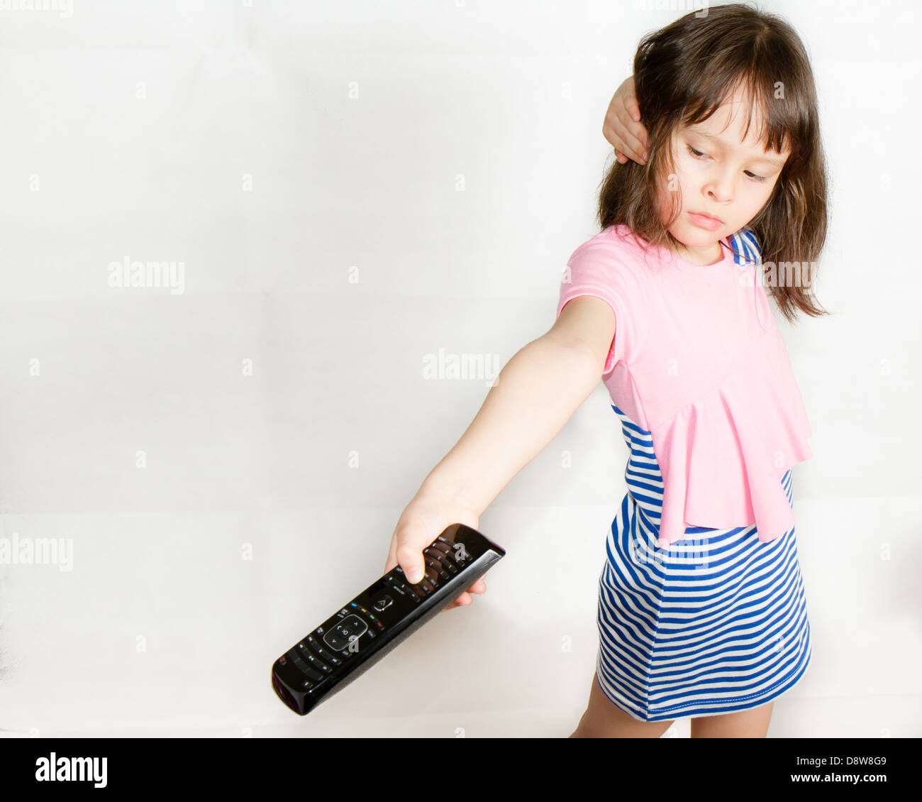 Asian child with remote control Stock Photo - Alamy