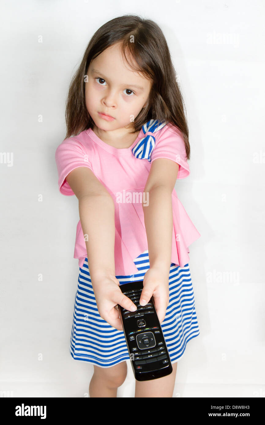 Asian child with remote control Stock Photo - Alamy
