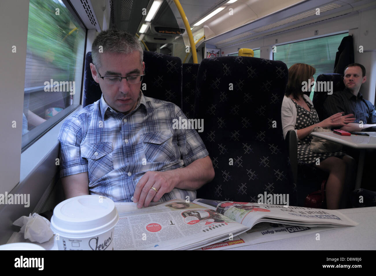 Reading waiting train hi-res stock photography and images - Alamy