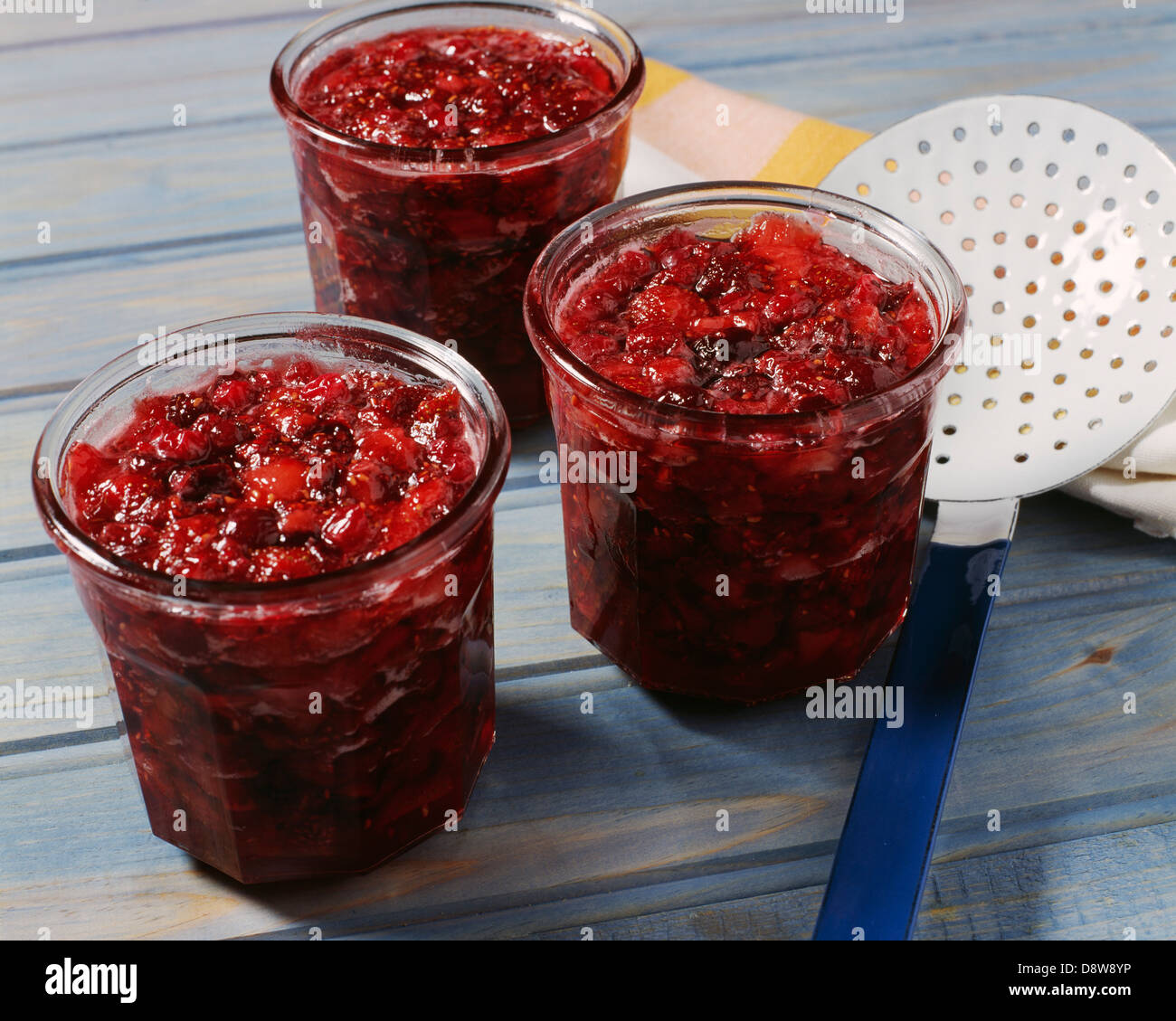Filling the jars with the jam Stock Photo - Alamy