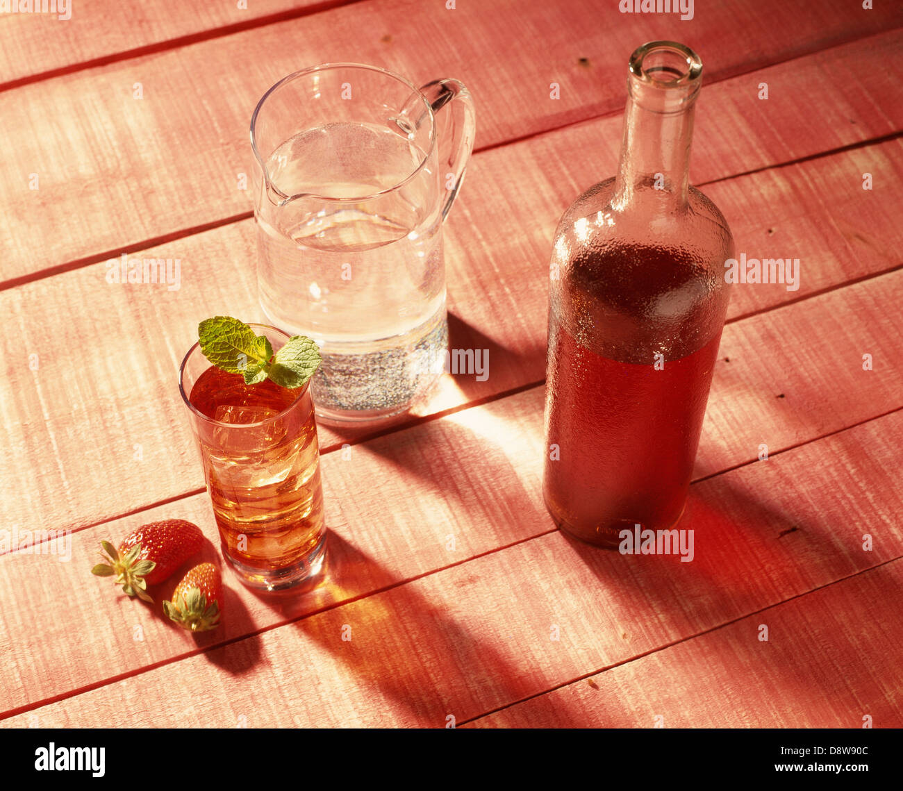 Mixing a dose of syrup with fresh water Stock Photo - Alamy